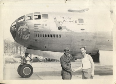 "United States Air Force Airplane, "Urgin Virgin II", with Two Men Shak"