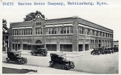 "Barron Motor Company Building and Cars"